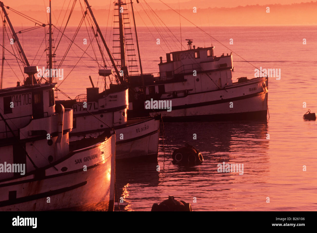 Fishing boats at sunrise Monterey California Stock Photo - Alamy