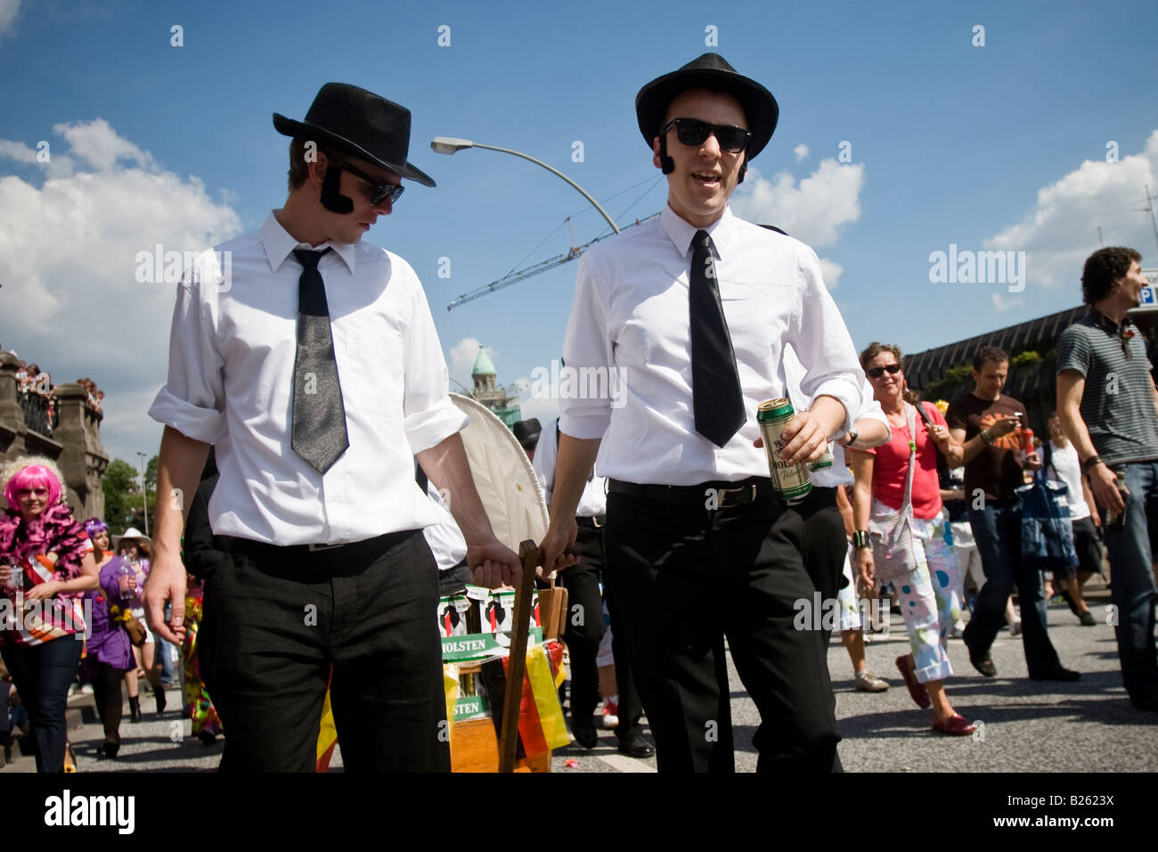 Two men dressed as Blues Brothers celebrate a german country music ...