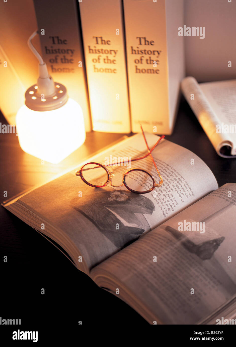 Glasses on books Stock Photo - Alamy
