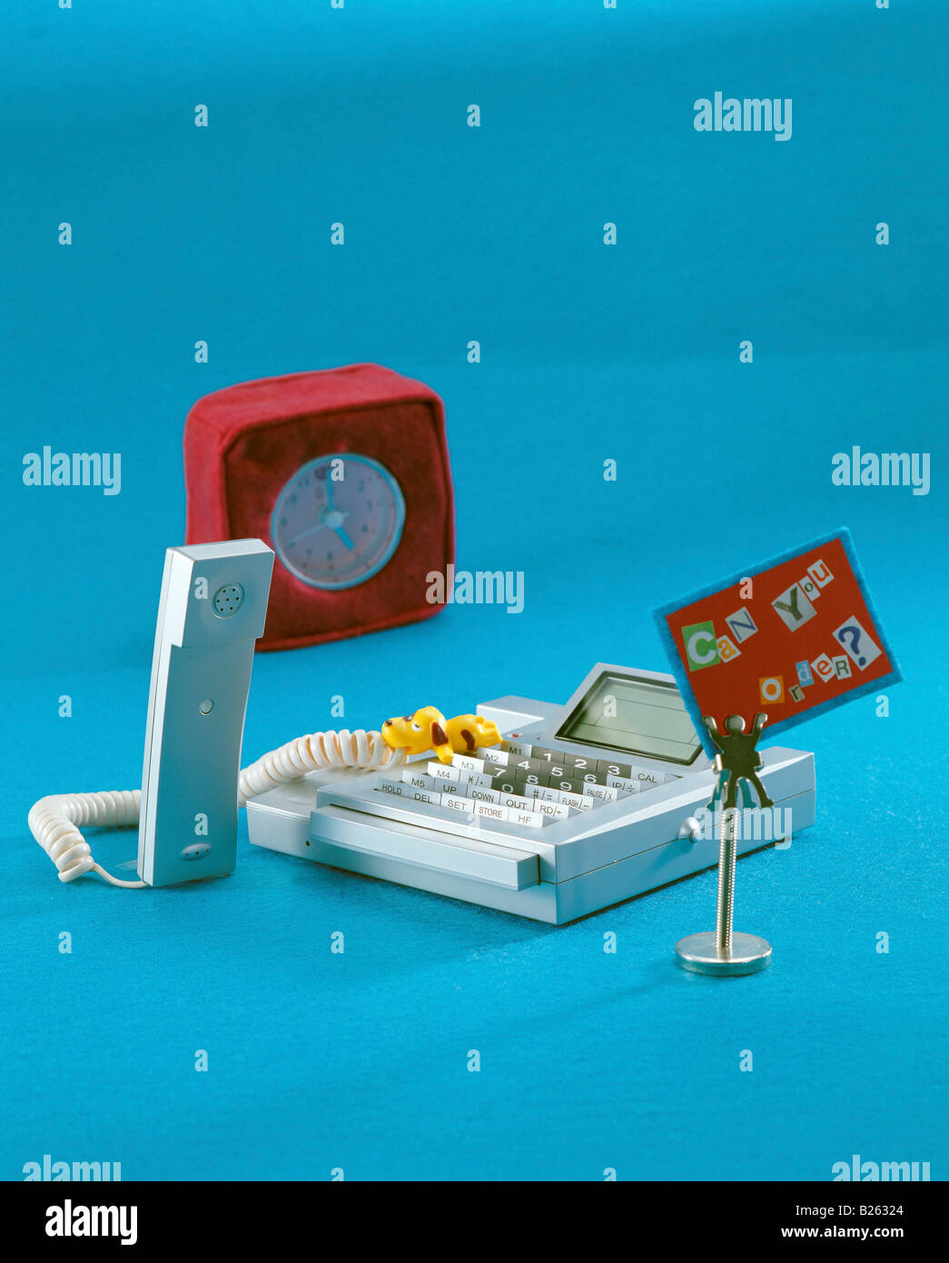 Telephone and clock Stock Photo - Alamy