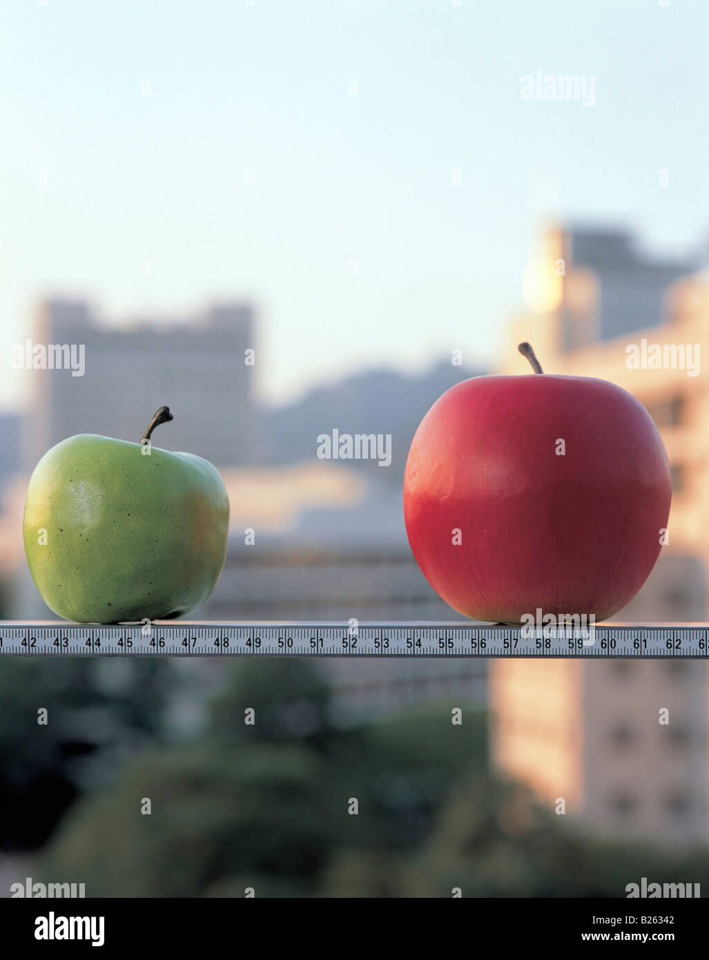Apples on ruler Stock Photo - Alamy