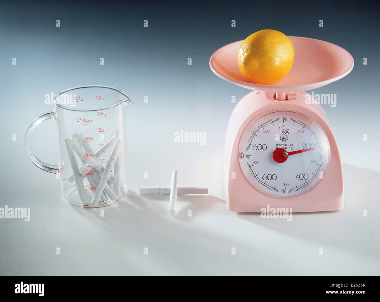 Lemon on kitchen scale Stock Photo - Alamy