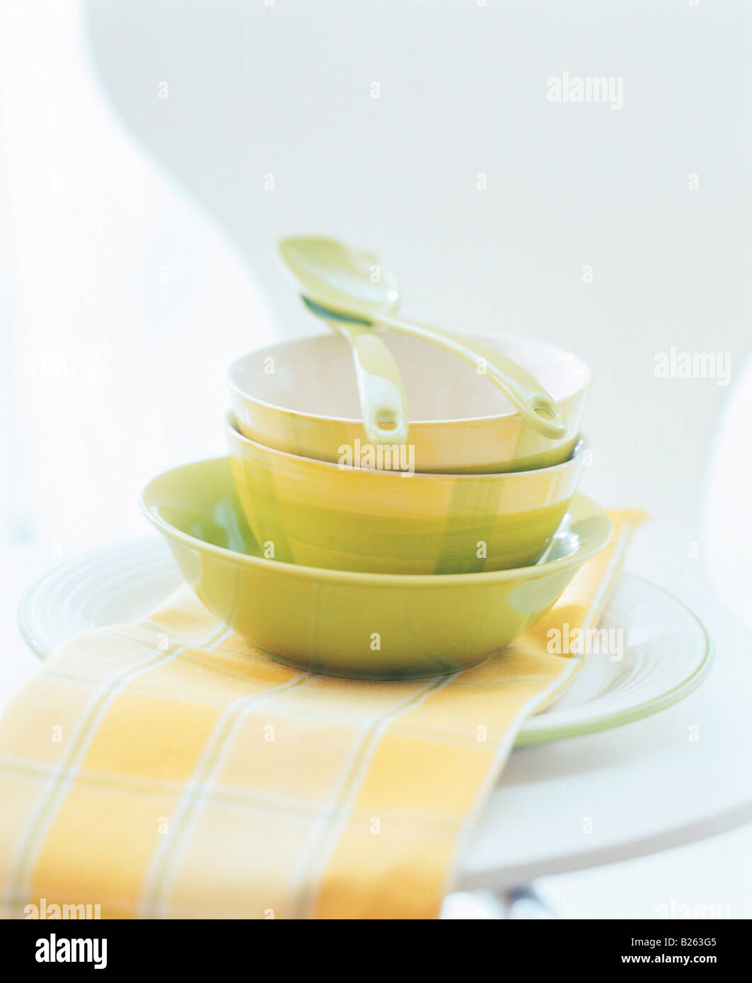 Plate with bowls and saucer Stock Photo - Alamy