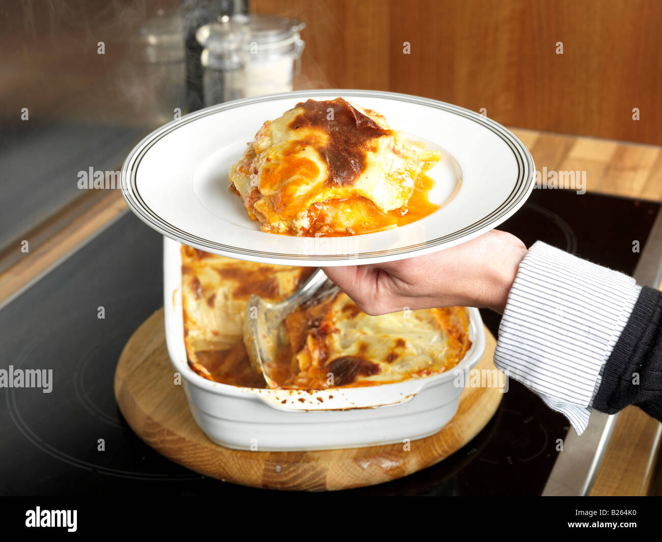 Woman lasagne hi-res stock photography and images - Alamy