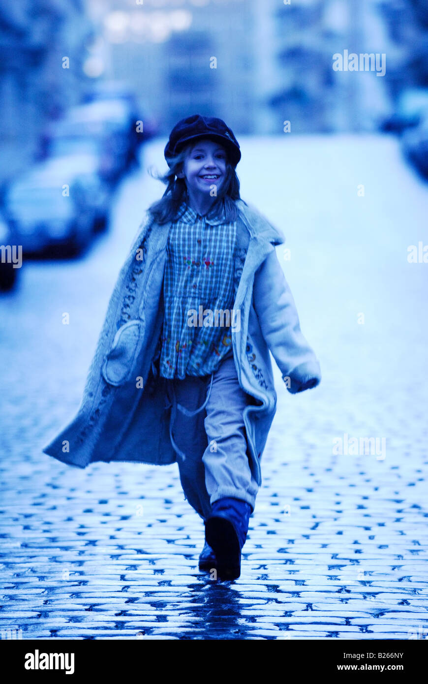 small girl walking in the street Stock Photo - Alamy