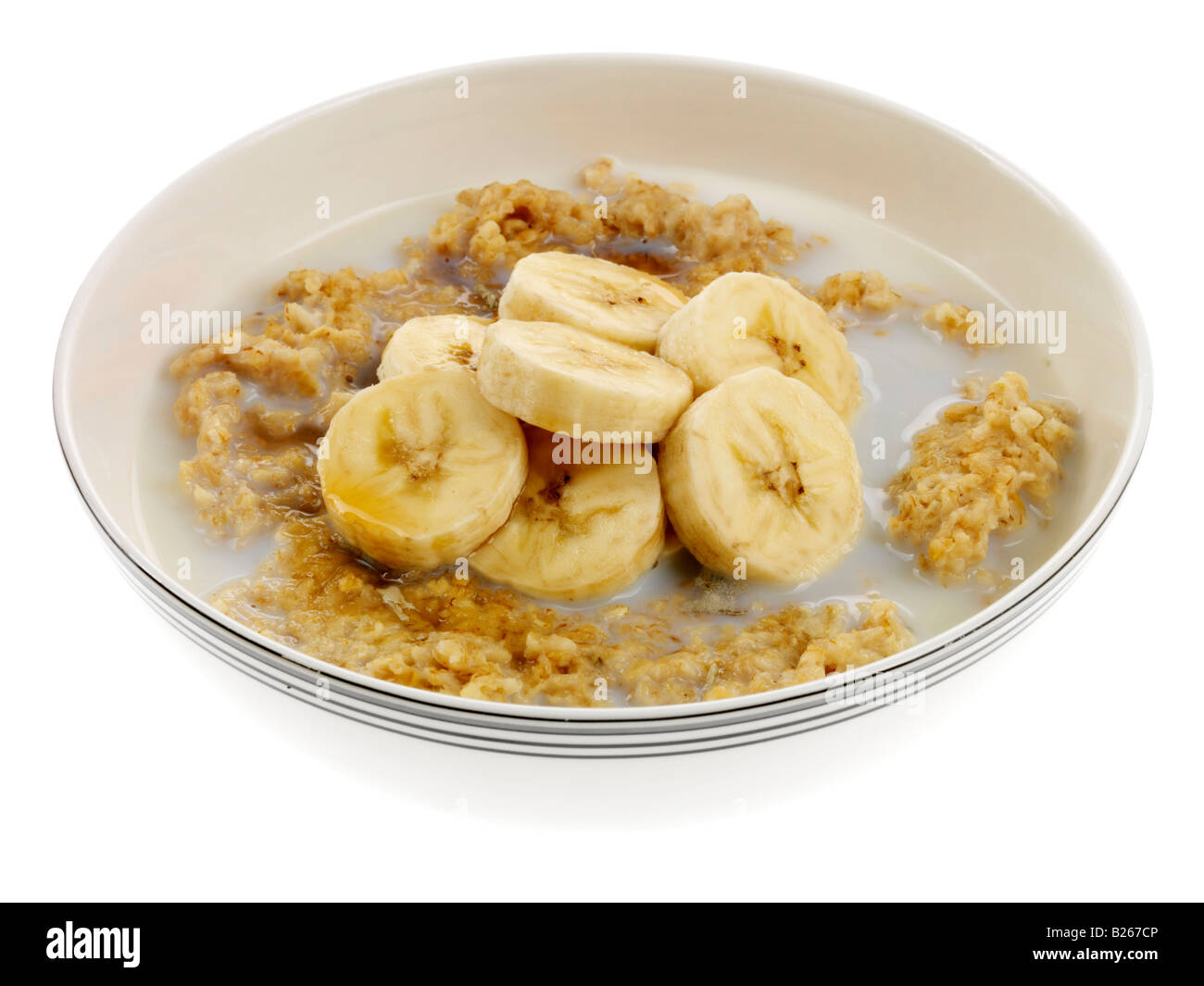 Porridge with Banana and Maple Syrup Stock Photo - Alamy