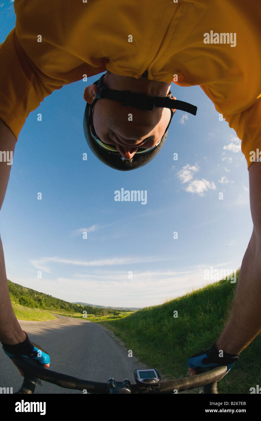 A man cycling on road Stock Photo - Alamy