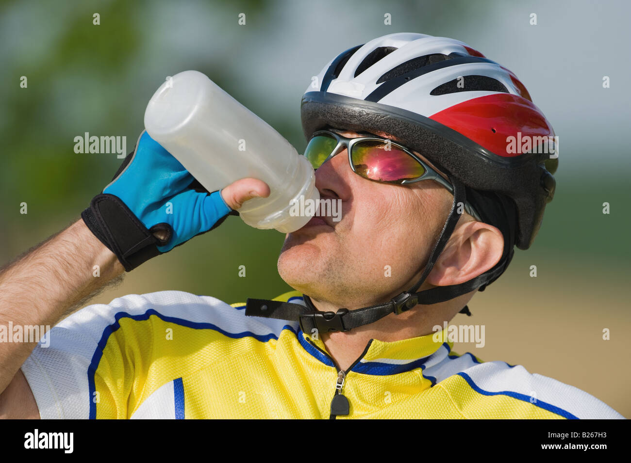 Cyclist drinking water, close-up Stock Photo - Alamy