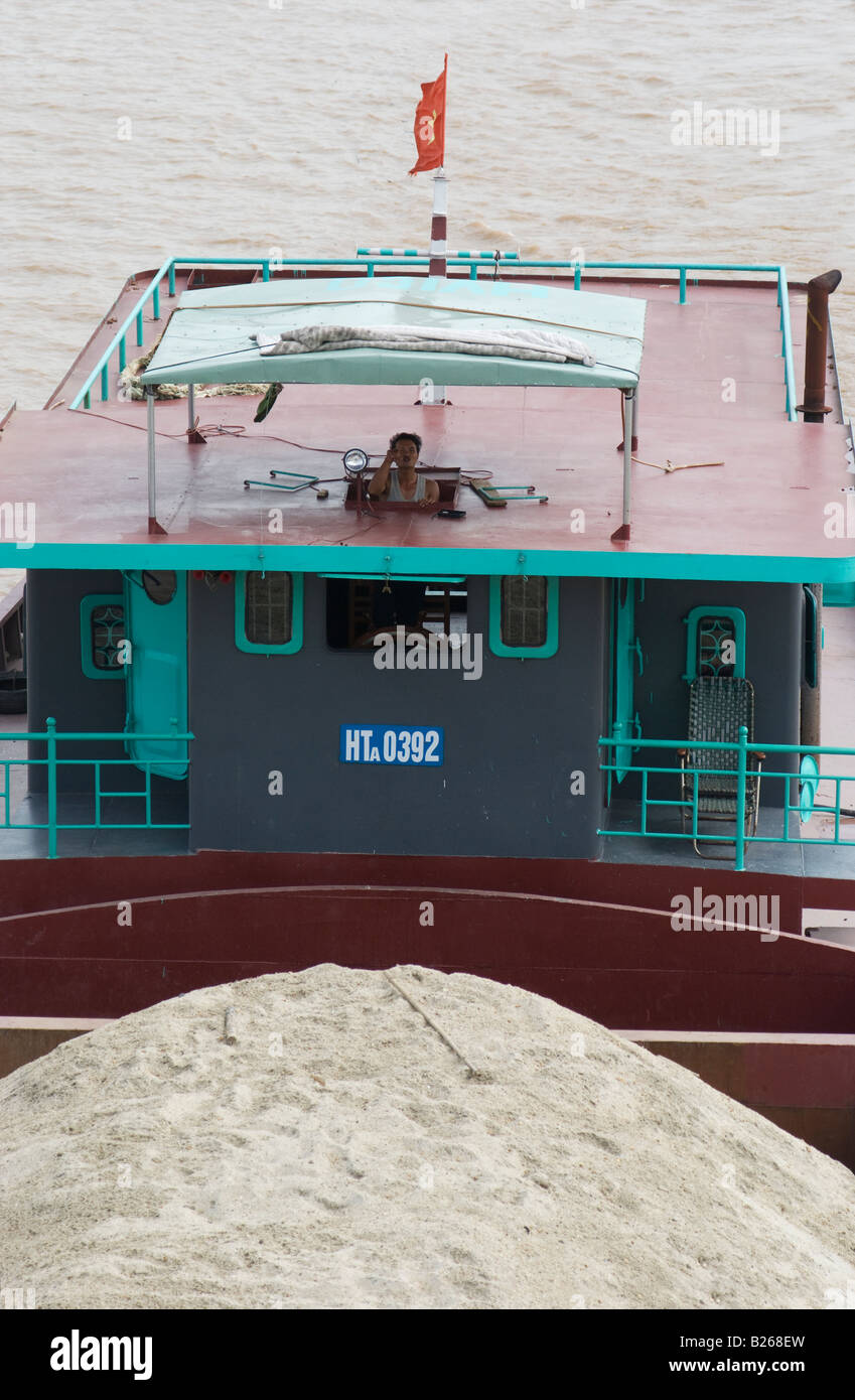 Cockpit of cargo vessel transporting sand down the Red River Stock ...