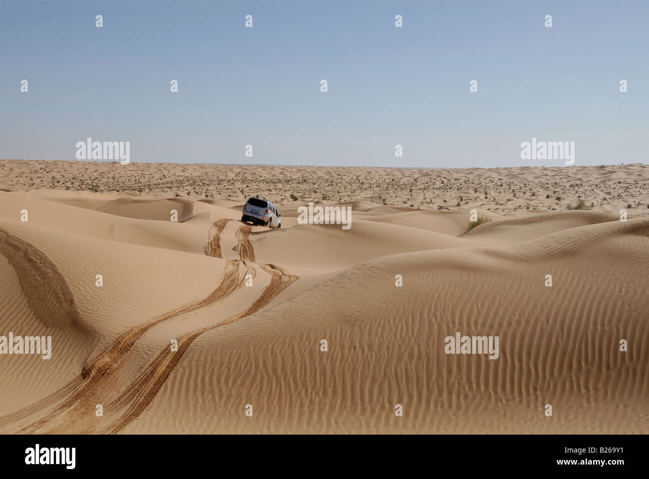 4x4 vehicle, jeep driving over sand dunes in the desert, Offroad 4x4 ...