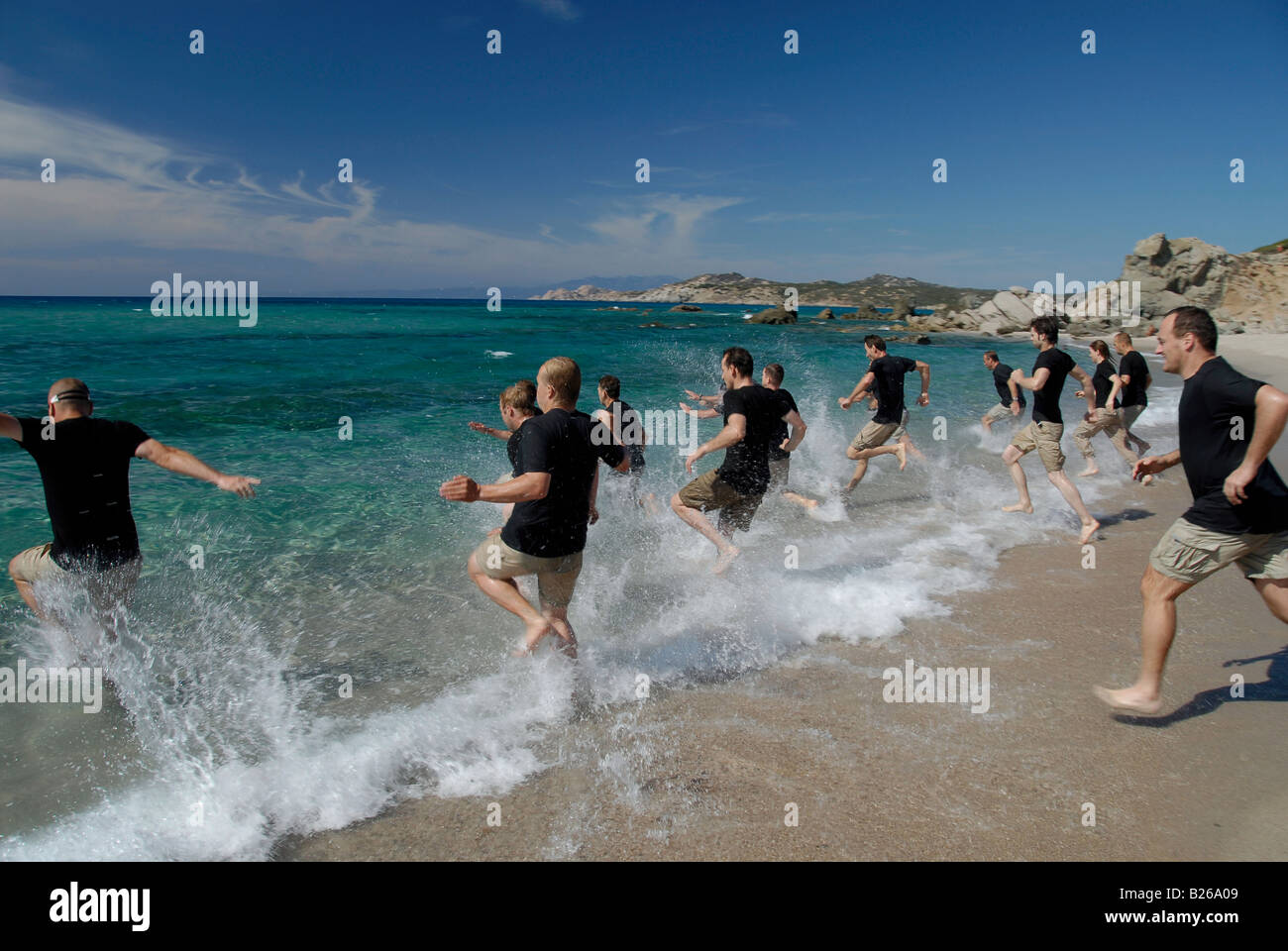 A group of men running into the sea, Adventure competition, North West ...