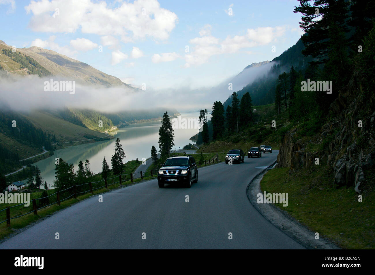 Five 4x4 vehicles on a country road, Kaunertal, Tyrol, Austria, Europe ...