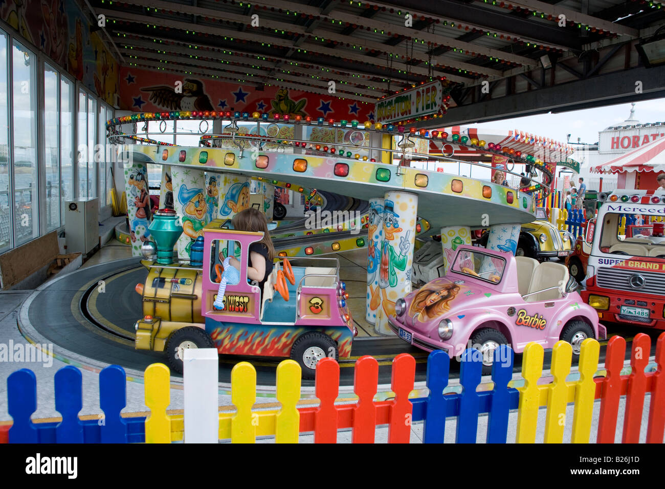 merry go round kids fair sea side Stock Photo - Alamy