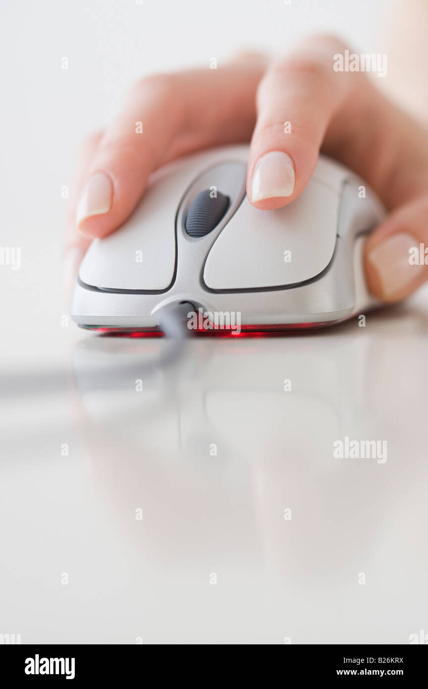 Woman’s hand on computer mouse Stock Photo - Alamy