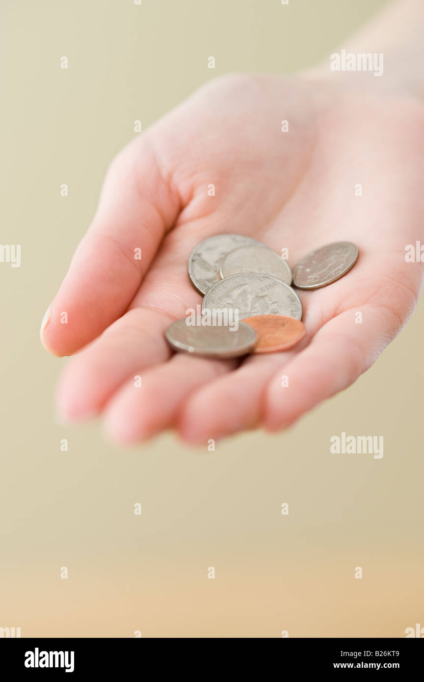 Coins in woman’s hand Stock Photo - Alamy