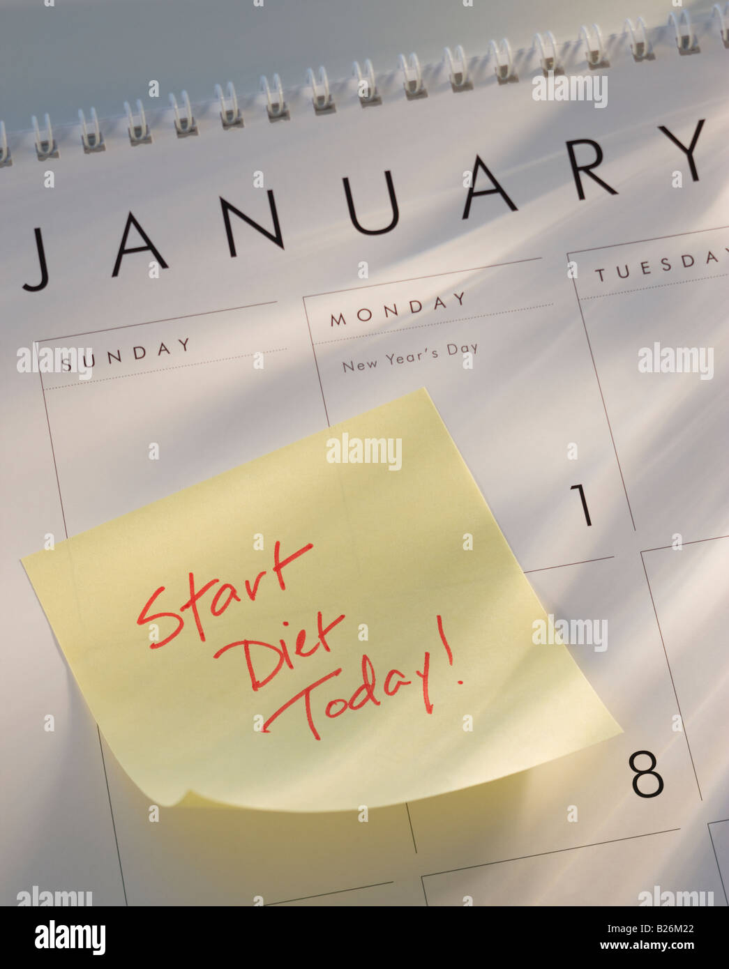 Sticky note on calendar Stock Photo - Alamy