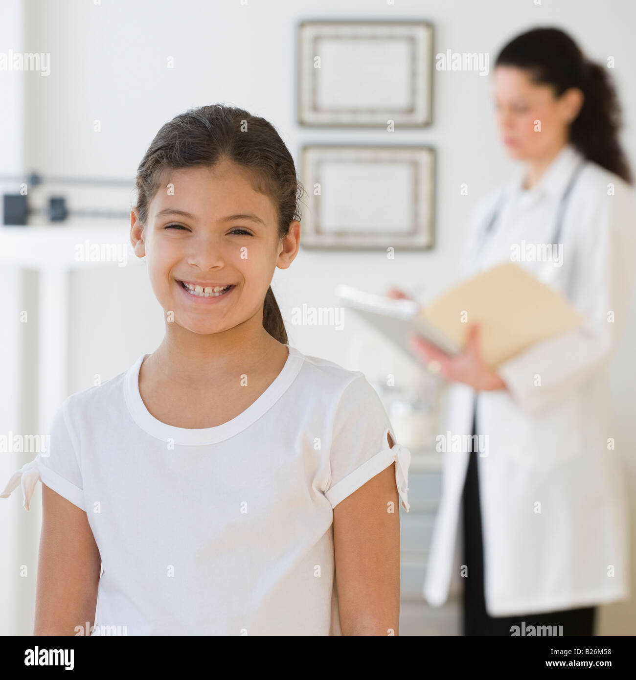 Hispanic girl in doctor’s office Stock Photo - Alamy