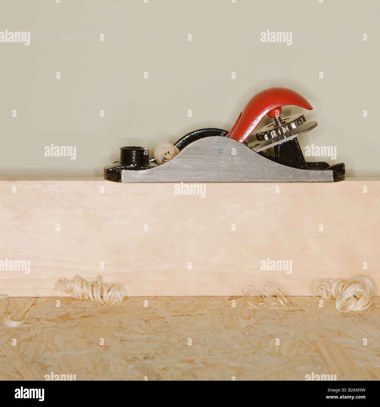 Woodworking plane on block of wood Stock Photo - Alamy