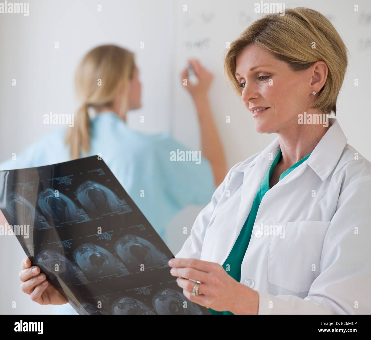 Female doctor looking at x-rays Stock Photo - Alamy