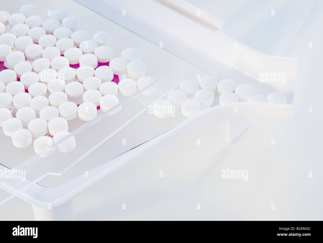 Close up of pills in measuring device Stock Photo - Alamy