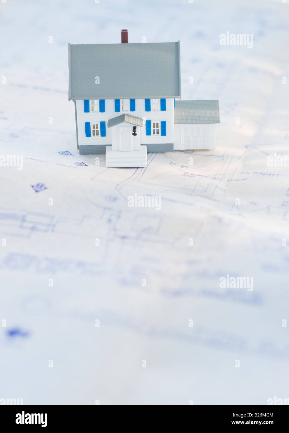 Model house on blueprints Stock Photo - Alamy