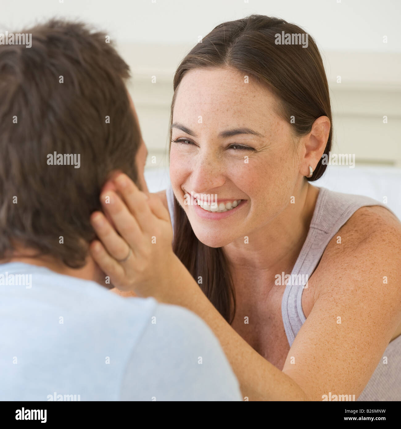 Hispanic woman smiling at husband Stock Photo - Alamy