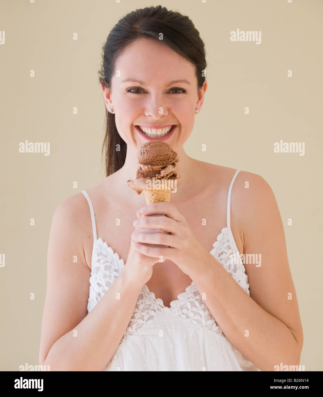 Woman eating ice cream cone Stock Photo - Alamy