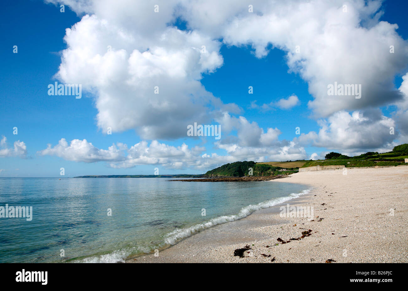 White clouds and calm sea at Gyllyngvase beach, Falmouth Cornwall UK ...