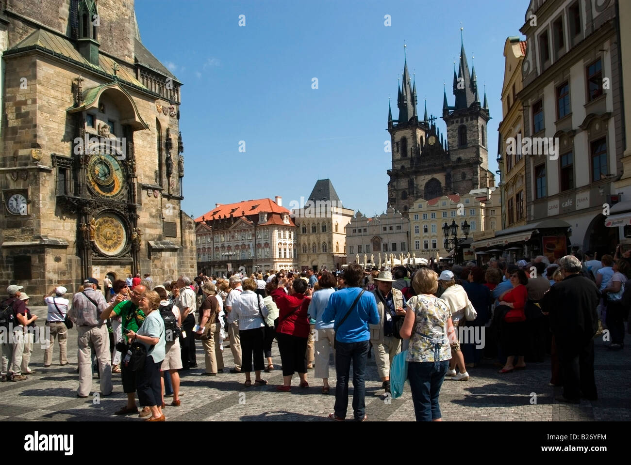 Tourists watching astronomical clock with chimes Orloj on city hall in ...