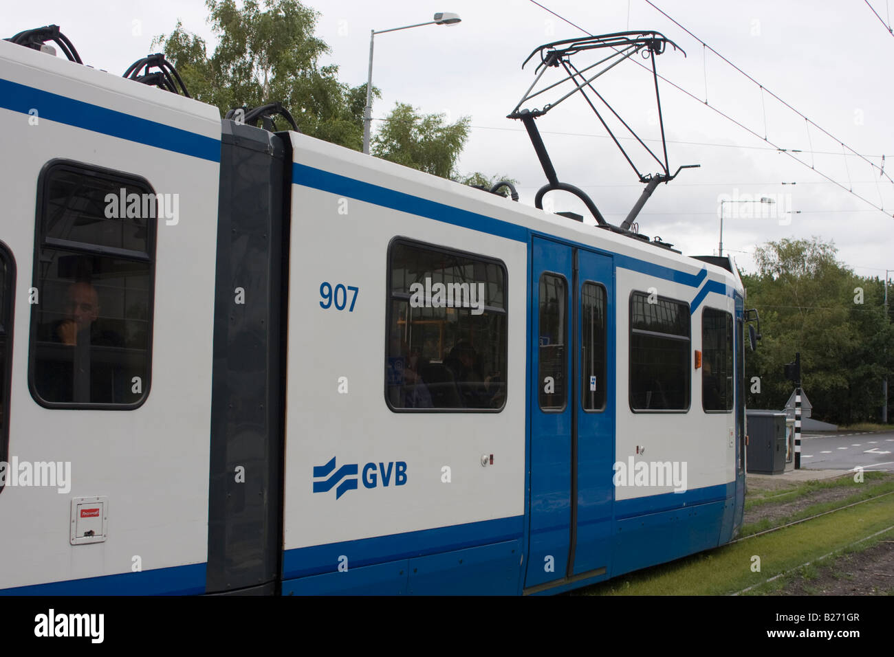 Side view of tram line 5 at a railway crossing near station Amsterdam ...