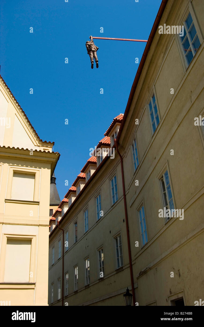 The sculpture of Hanging Man artistic decoration in the street in the ...