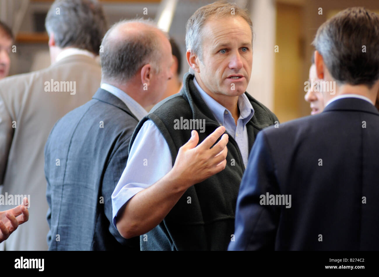 Royalty free photograph of a British business men in meeting talking ...