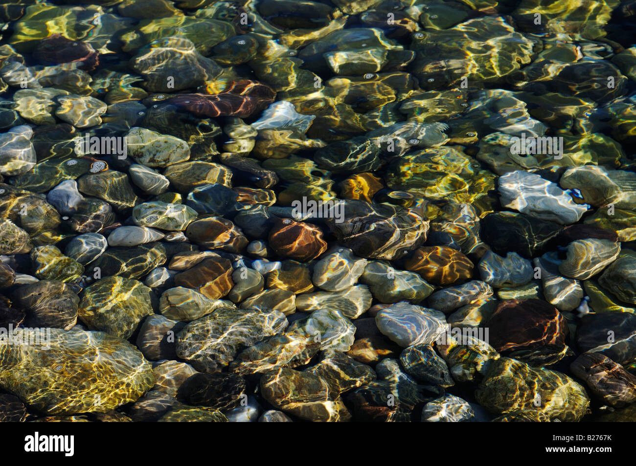 Pebbles in sea Greece Stock Photo - Alamy