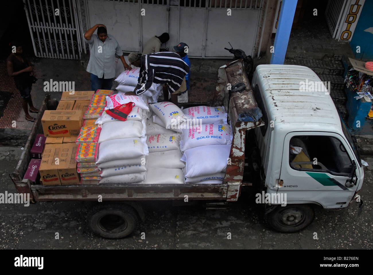Local people loading a truck in Jacmel, Haiti, Hispaniola, Caribbean ...