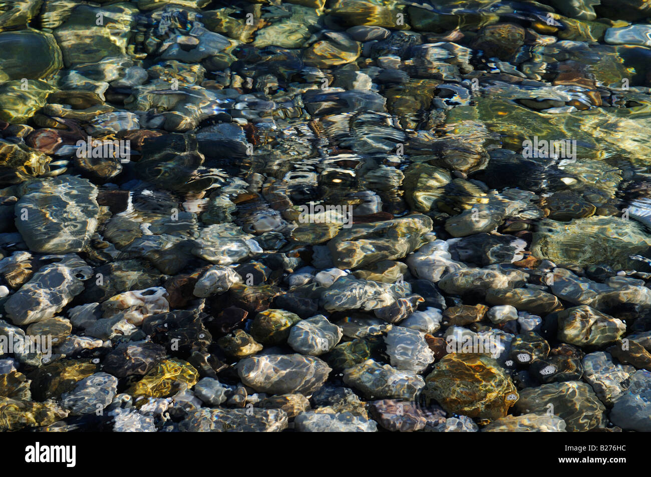 Pebbles in sea Greece Stock Photo - Alamy