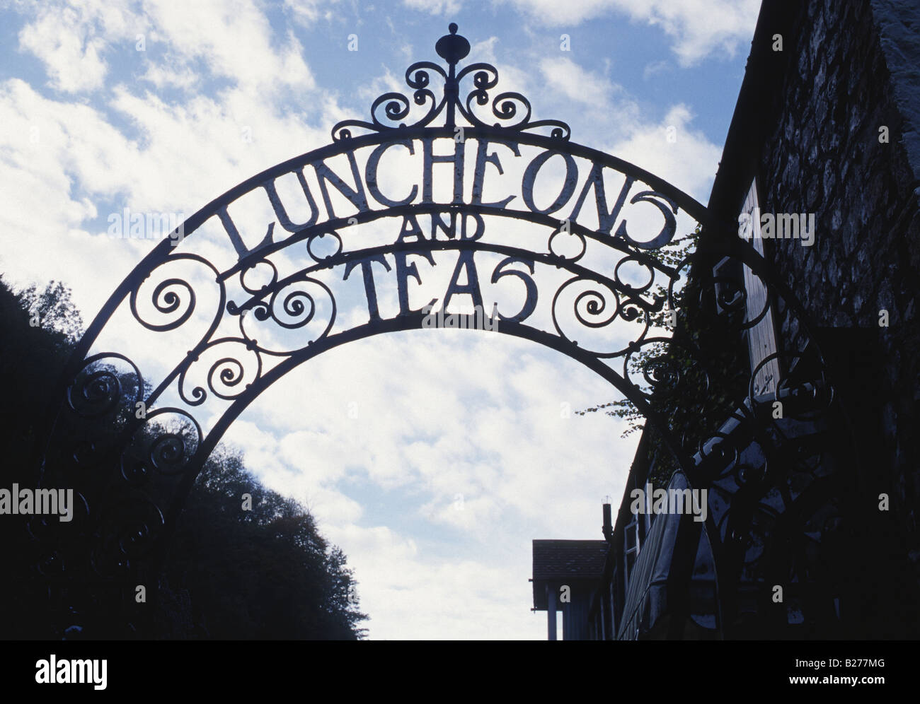 CHEDDAR GORGE Somerset UK England, wrought iron sign silhouetted ...