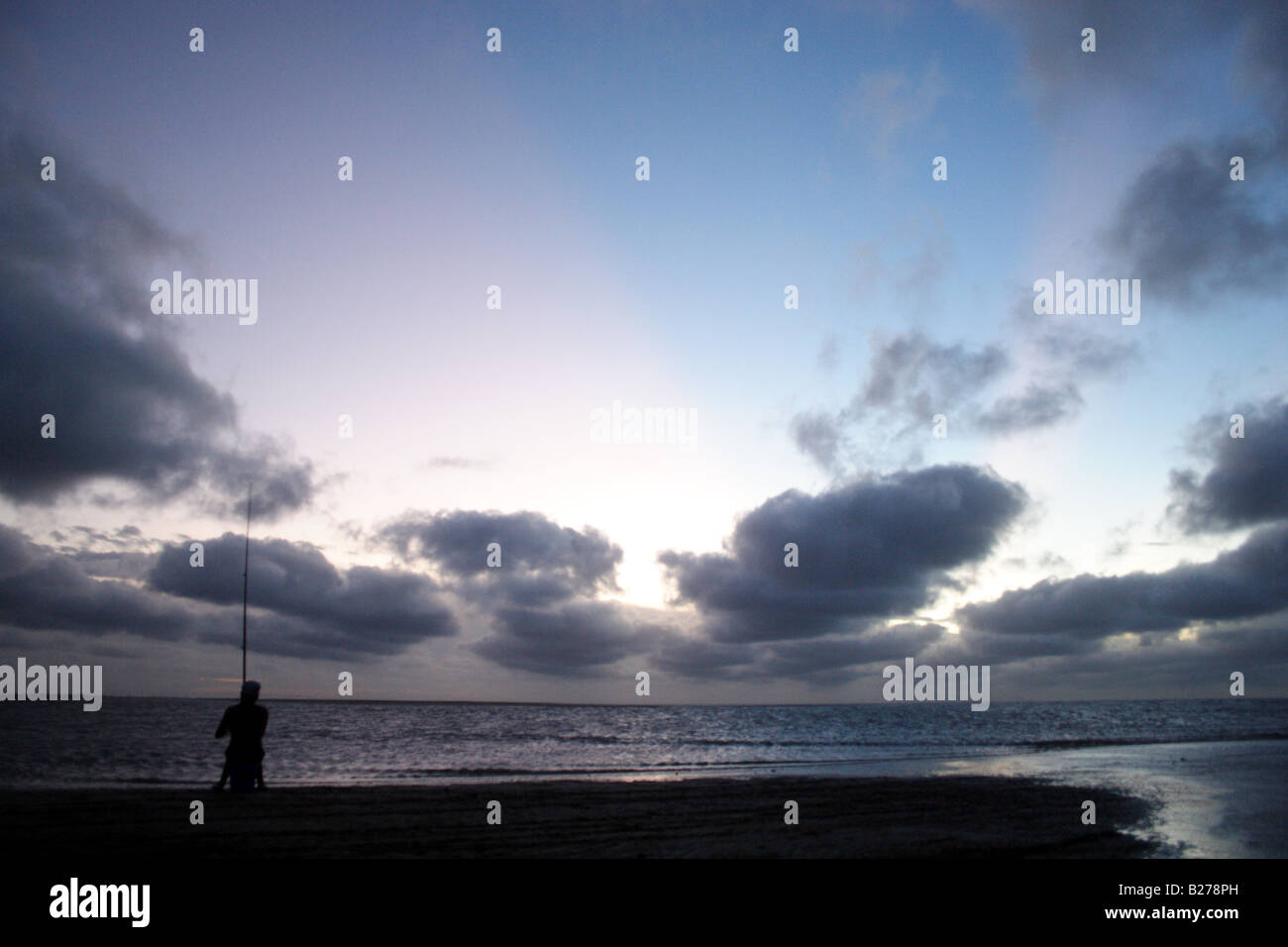 man fishing alone at sunset 1 Stock Photo - Alamy
