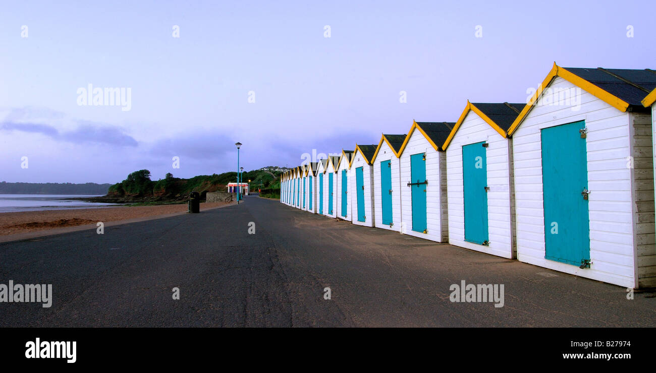 Blue and white beach huts just before dawn on the promenadxe at ...