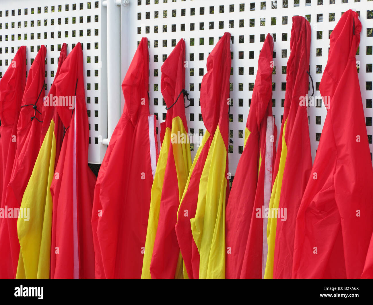 Row of waterproof raincoats Stock Photo - Alamy