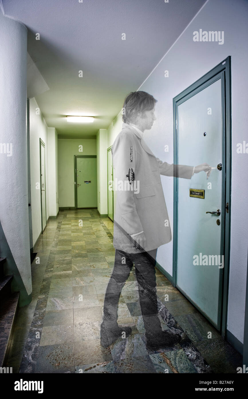 Discreet neighbor open the door Stock Photo - Alamy