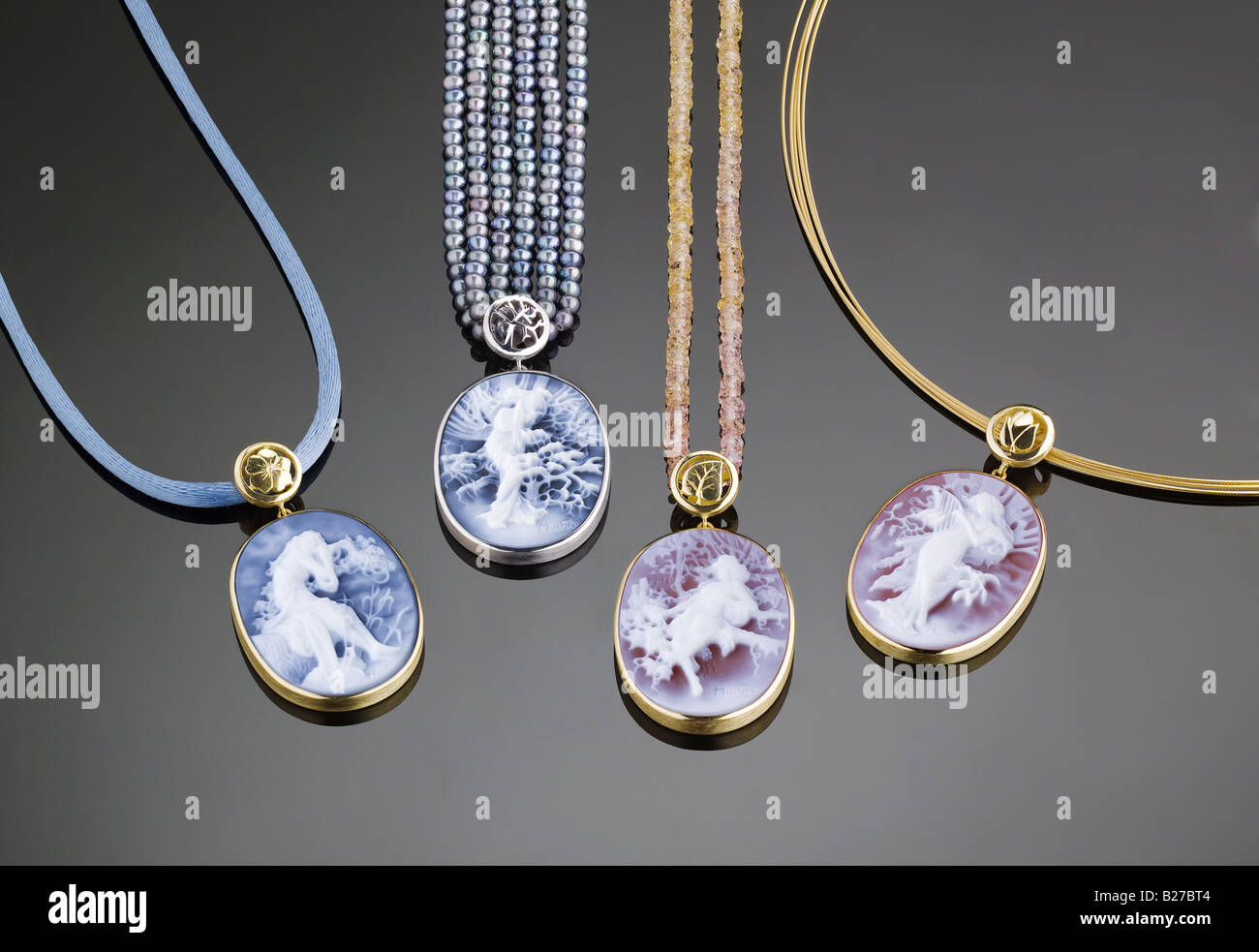 Display of necklaces with different pendants Stock Photo - Alamy
