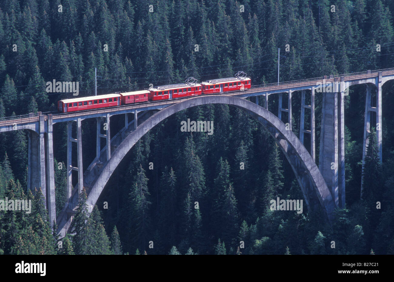 Raethische Bahn train on the viaduct near Langwies Grisons Switzerland ...