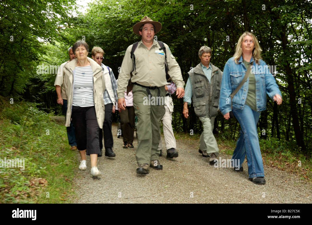 ranger with hiking group on a guided trip across National Park nature ...