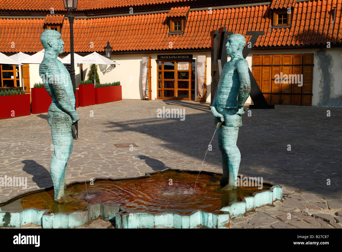 The statues at the courtyard of the Franz Kafka museum in Prague Stock ...