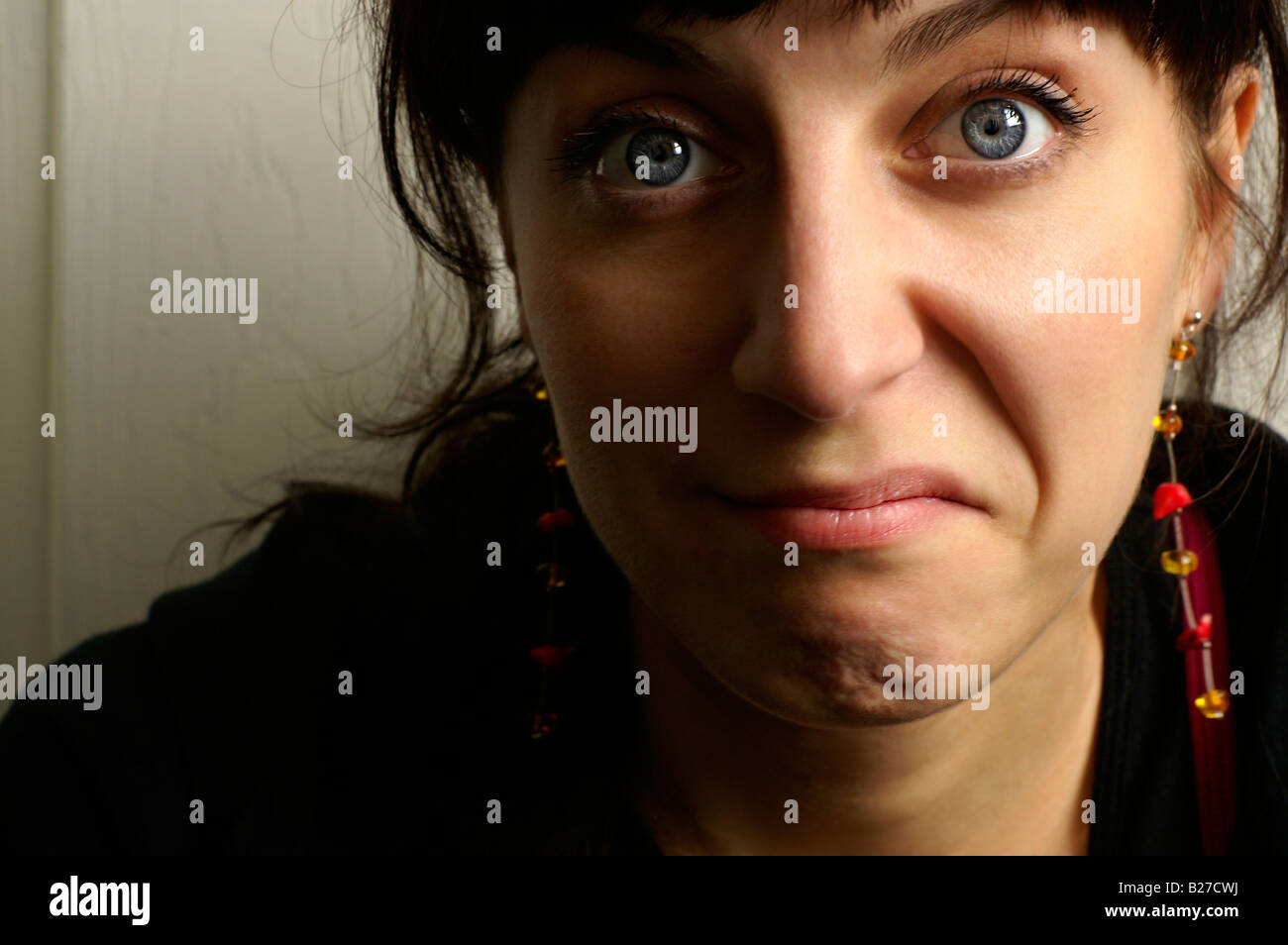 surprised woman in half shadow Stock Photo - Alamy