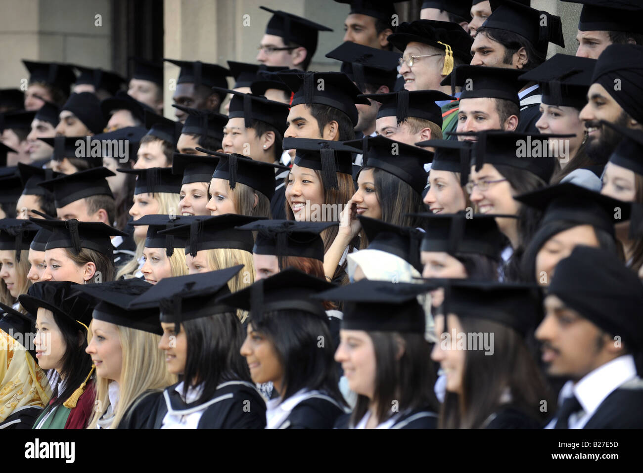 Students graduation uk throwing caps hi-res stock photography and ...