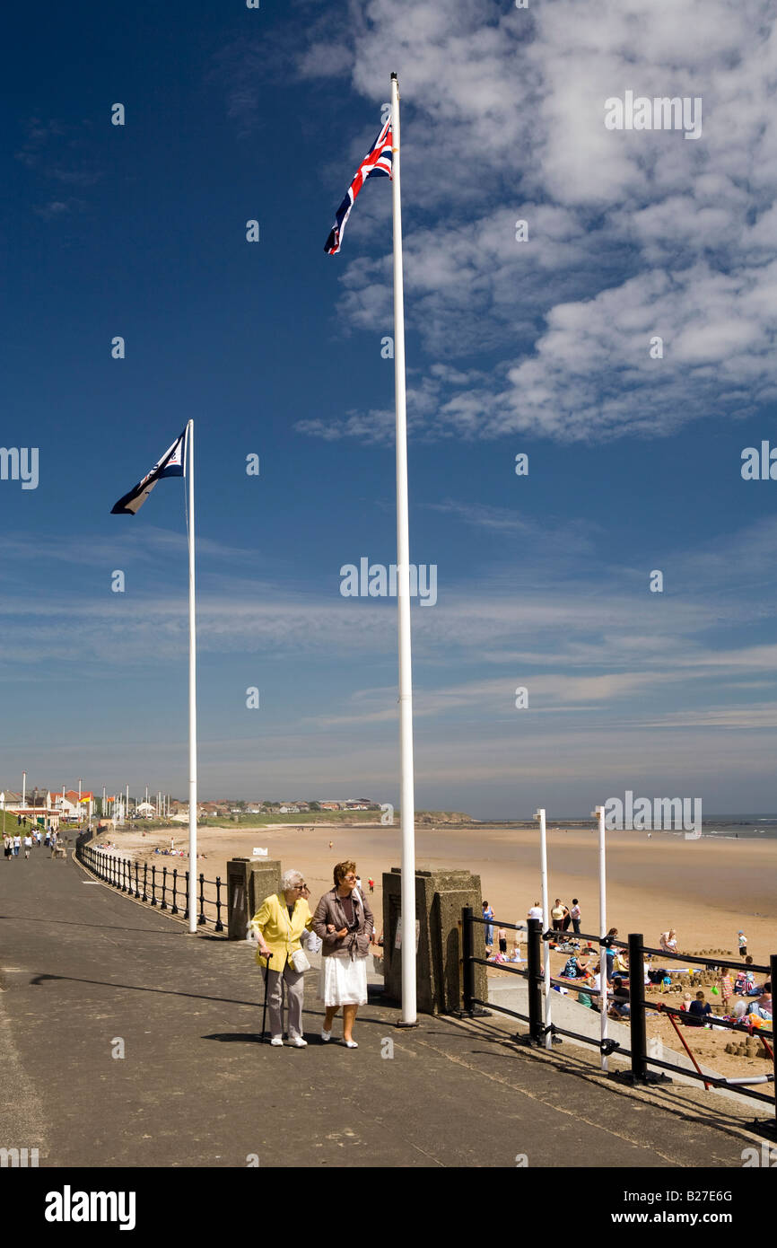 UK Tyne and Wear Sunderland Seaburn older people walking along Whitburn ...