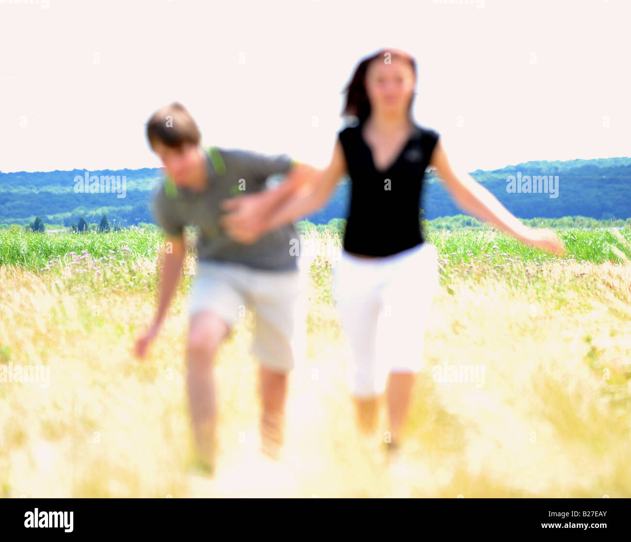 Two teenagers running boy girl hi-res stock photography and images - Alamy