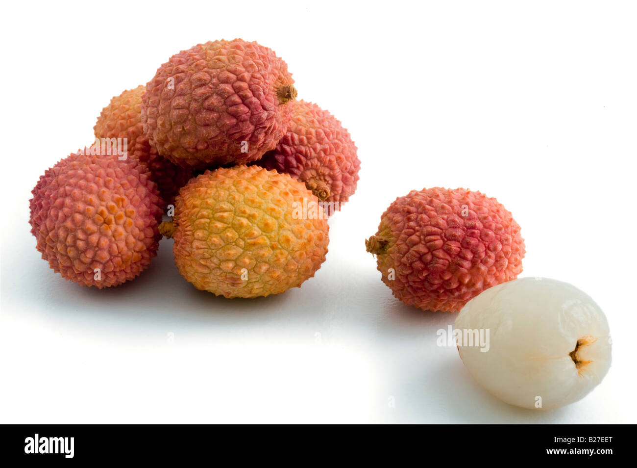 group of lychee and one peeled isolated on white Stock Photo - Alamy