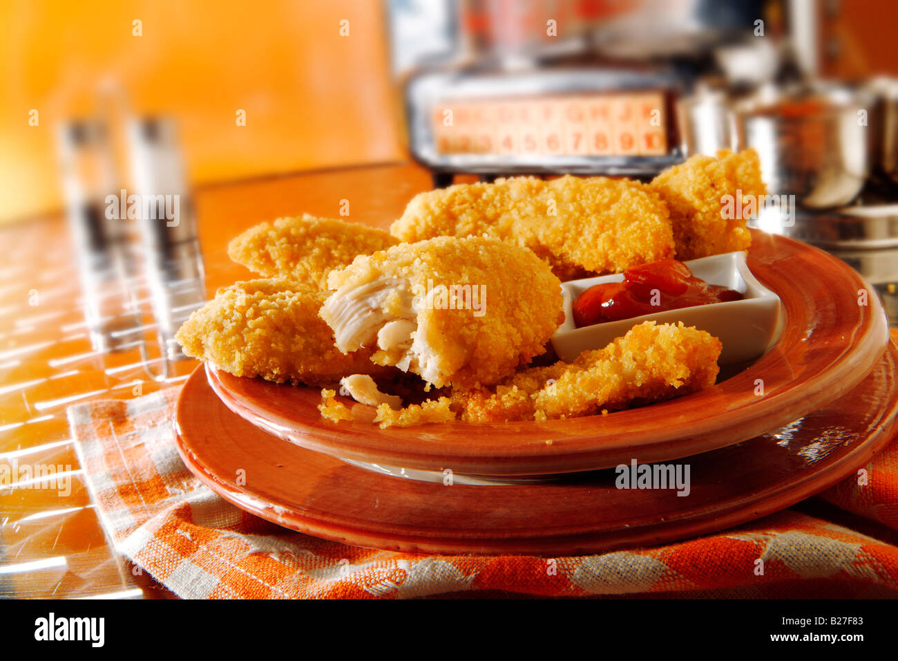 breaded chicken in an american diner setting Stock Photo - Alamy